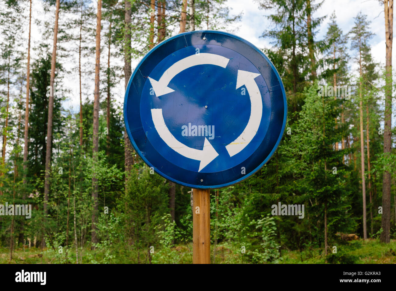 Roundabout sign in the wood Stock Photo - Alamy
