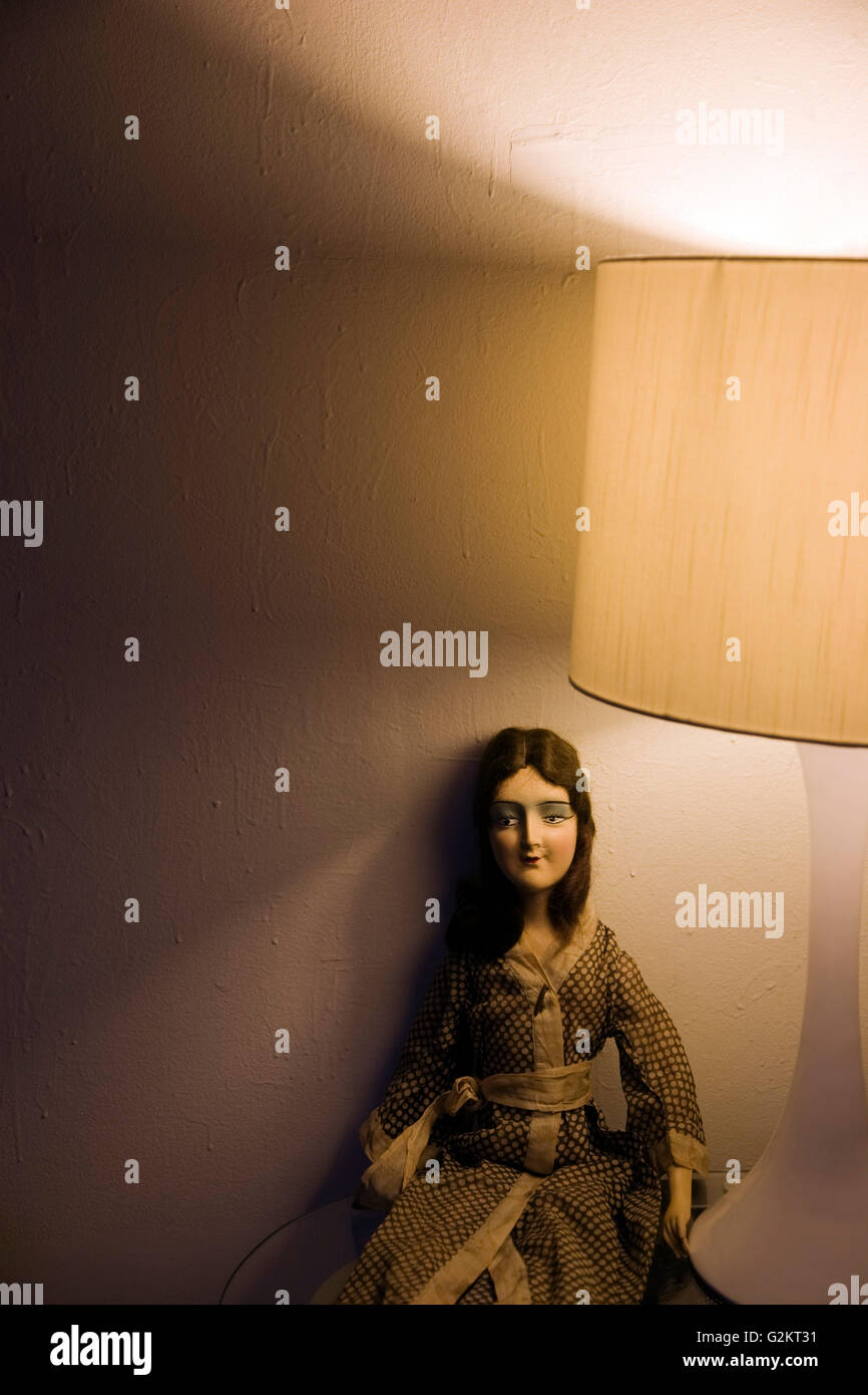 Vintage Porcelain Doll Next to Illuminated Table Lamp Stock Photo - Alamy