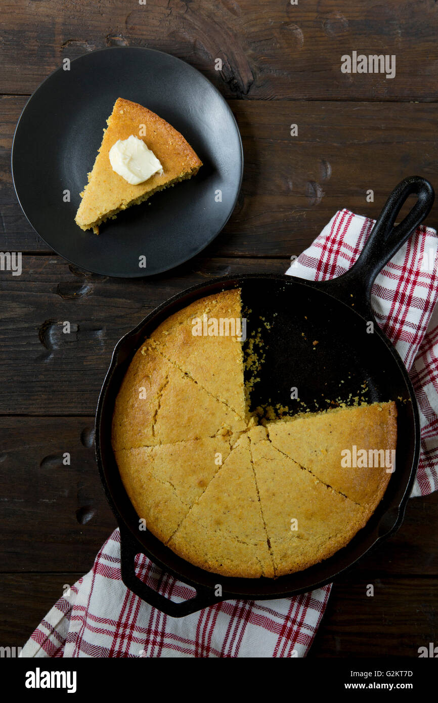 Cornbread in Cast-iron Skillet and Slice of Cornbread with Butter on ...