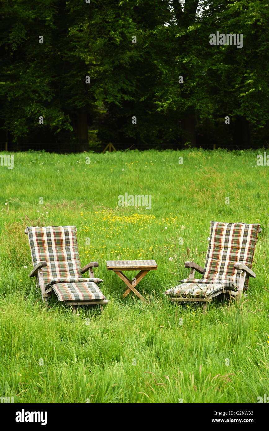 Two seats in a garden Stock Photo - Alamy