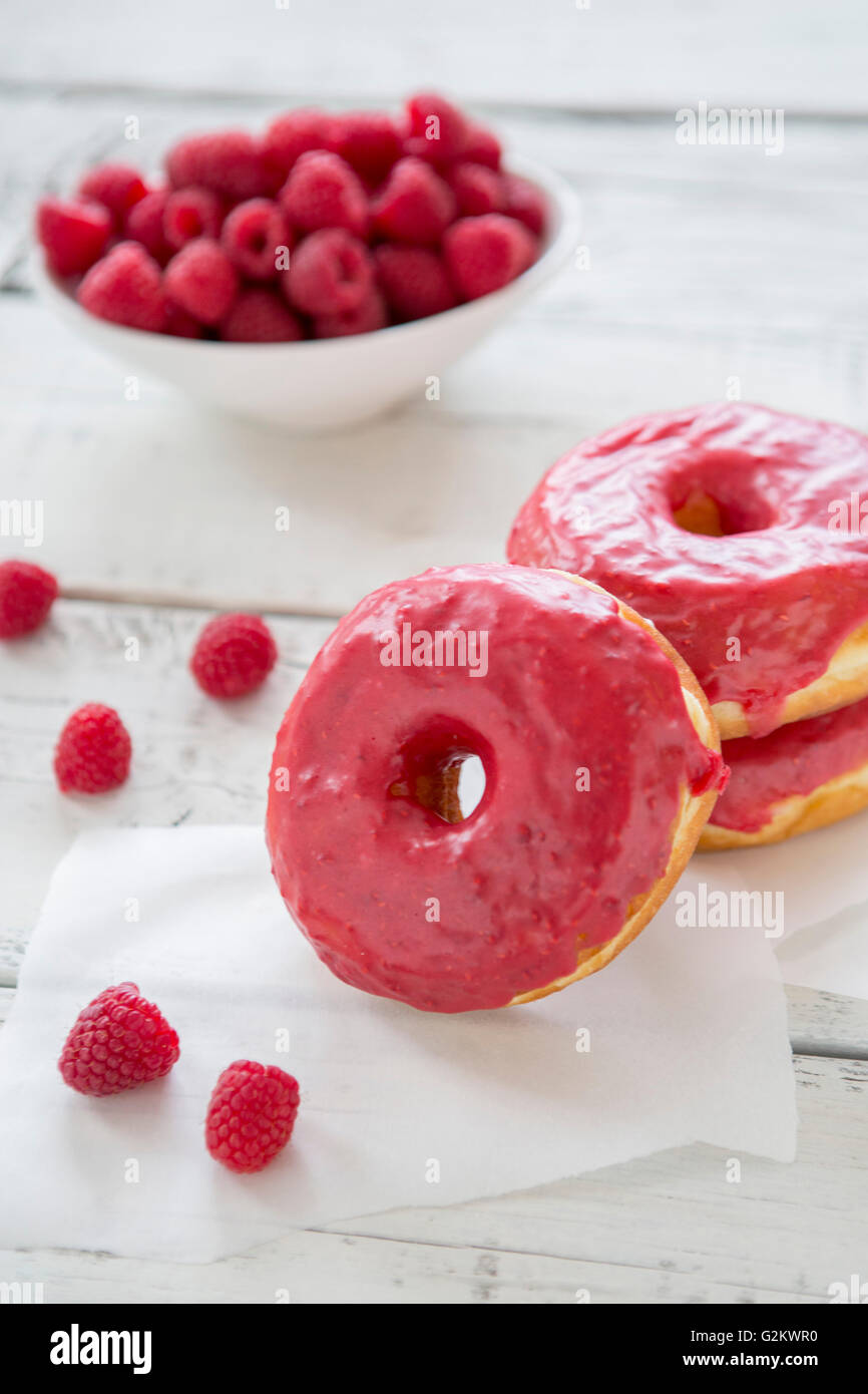 Donuts with Raspberry Icing Stock Photo - Alamy