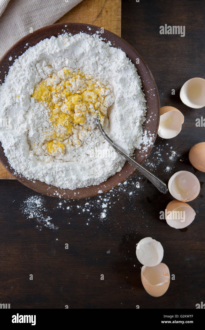 Mixing eggs and flour in bowl hi-res stock photography and images - Alamy