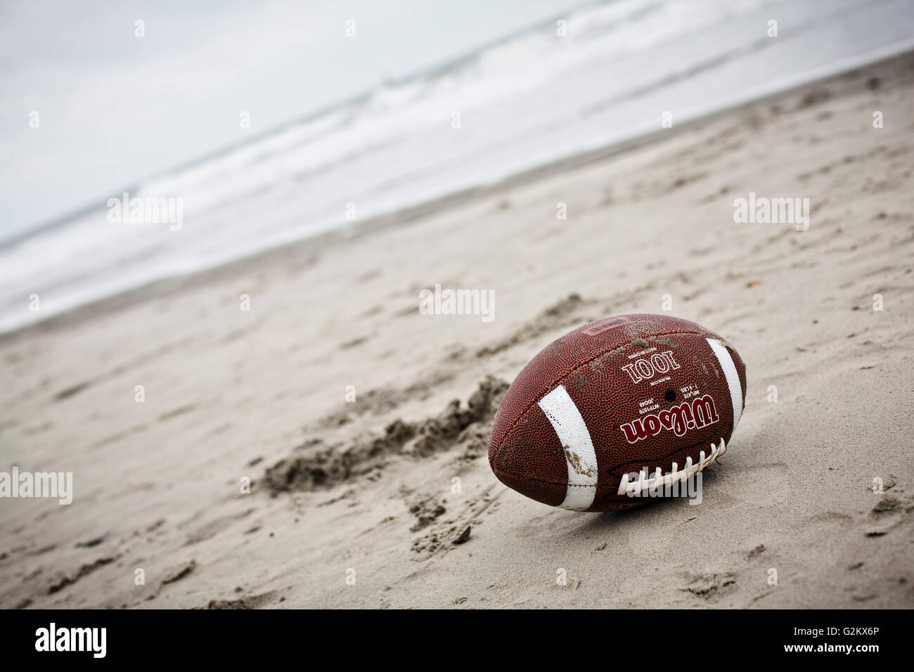 Football on Beach Stock Photo - Alamy