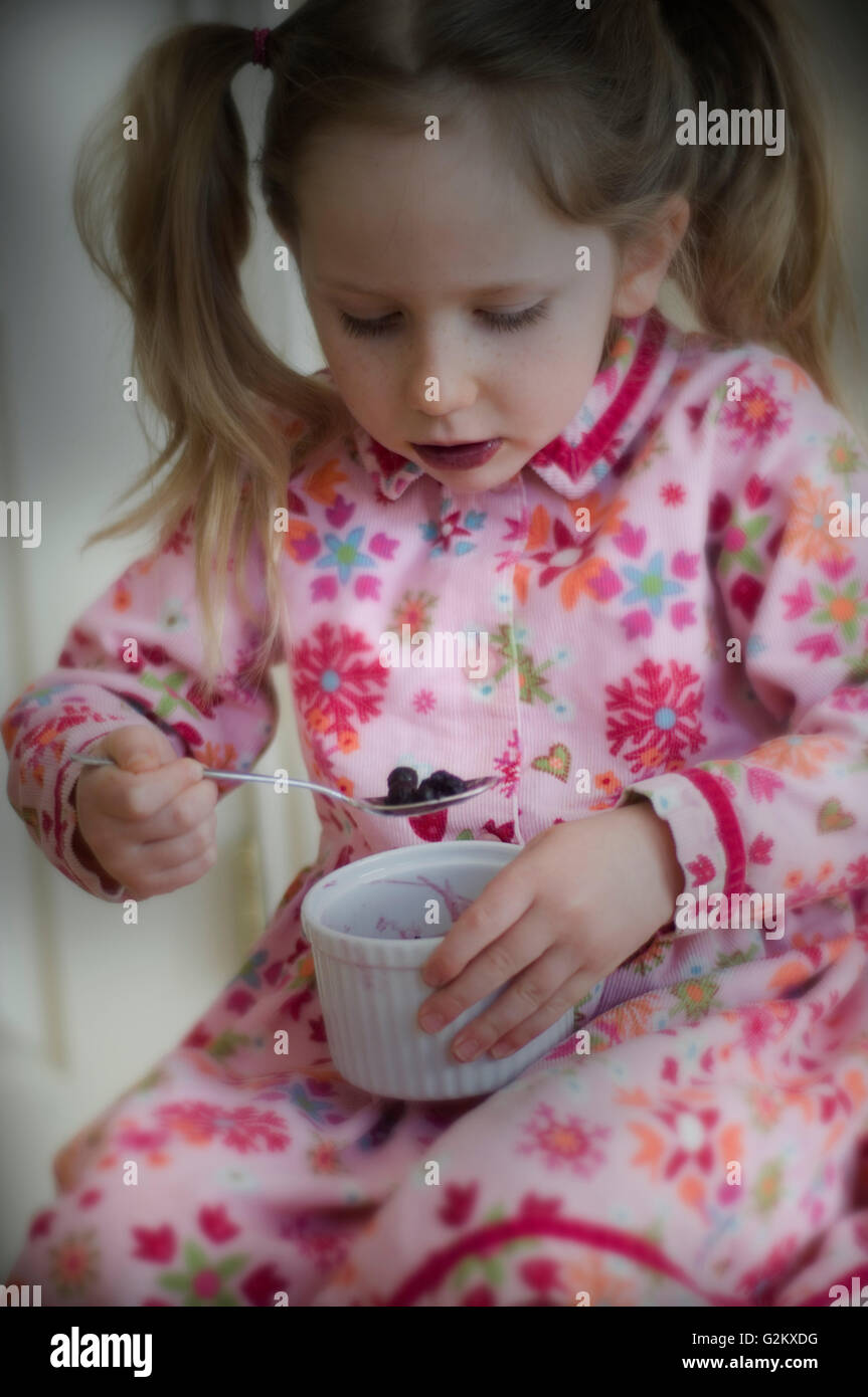 Girl Eating Blueberries Stock Photo - Alamy