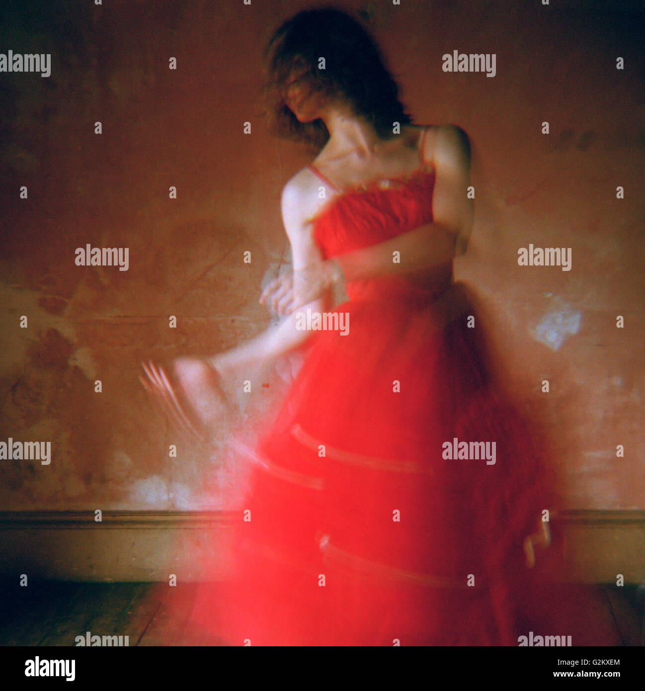 Woman Dancing in Red Dress Stock Photo - Alamy
