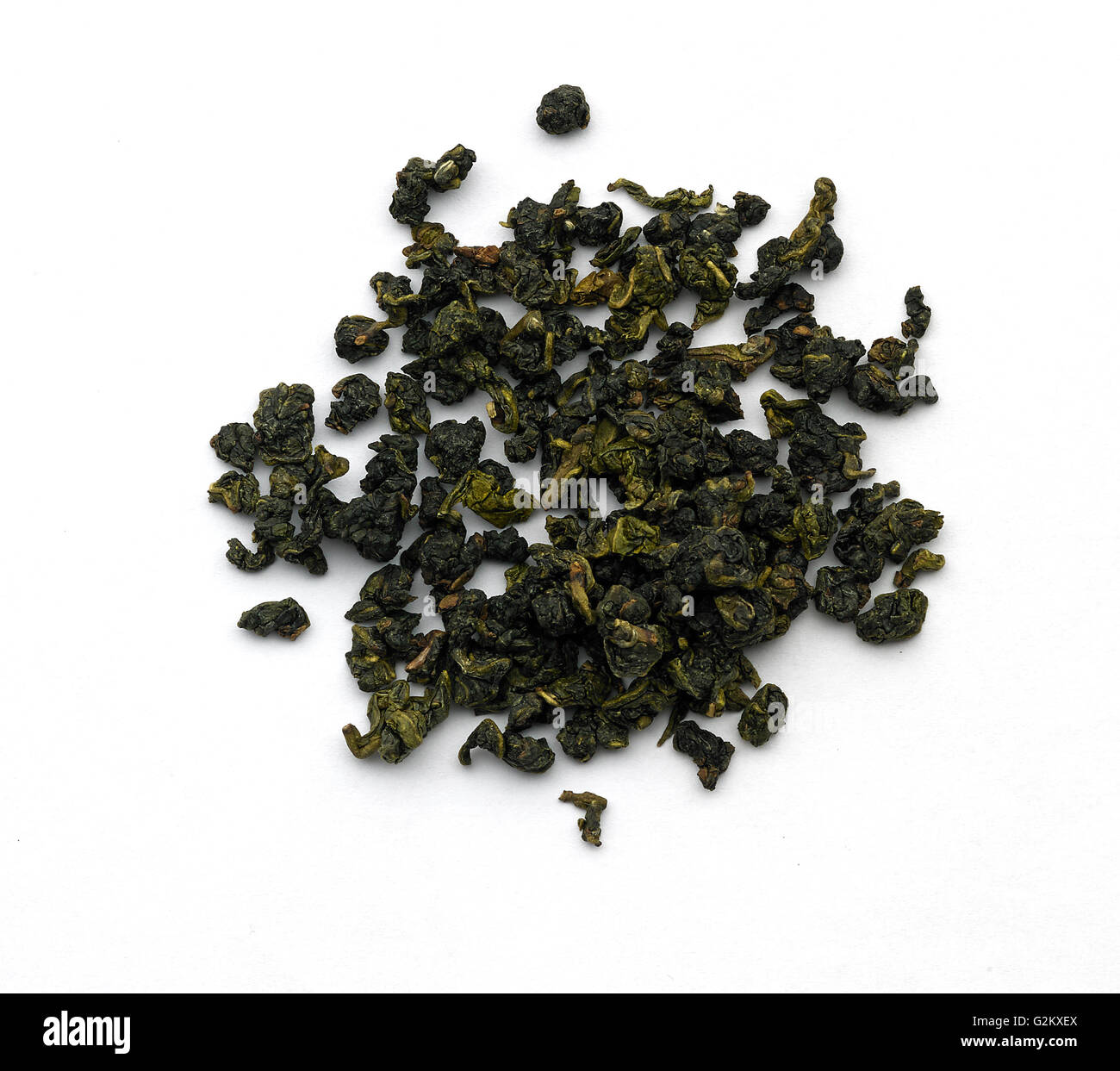 Oolong tea leaves on white background Stock Photo - Alamy