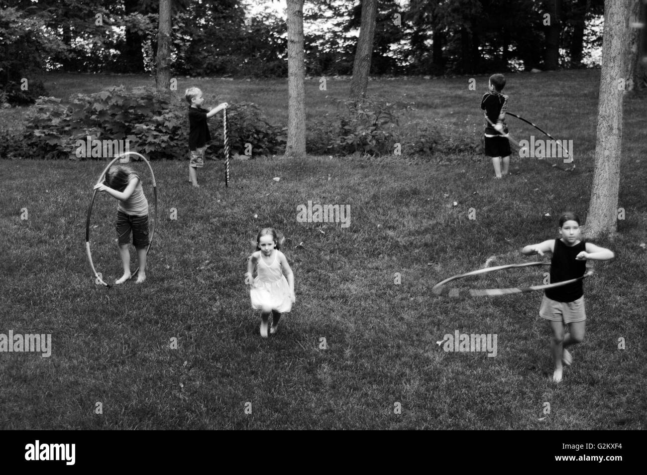 Kids Playing with Hula Hoops Stock Photo - Alamy