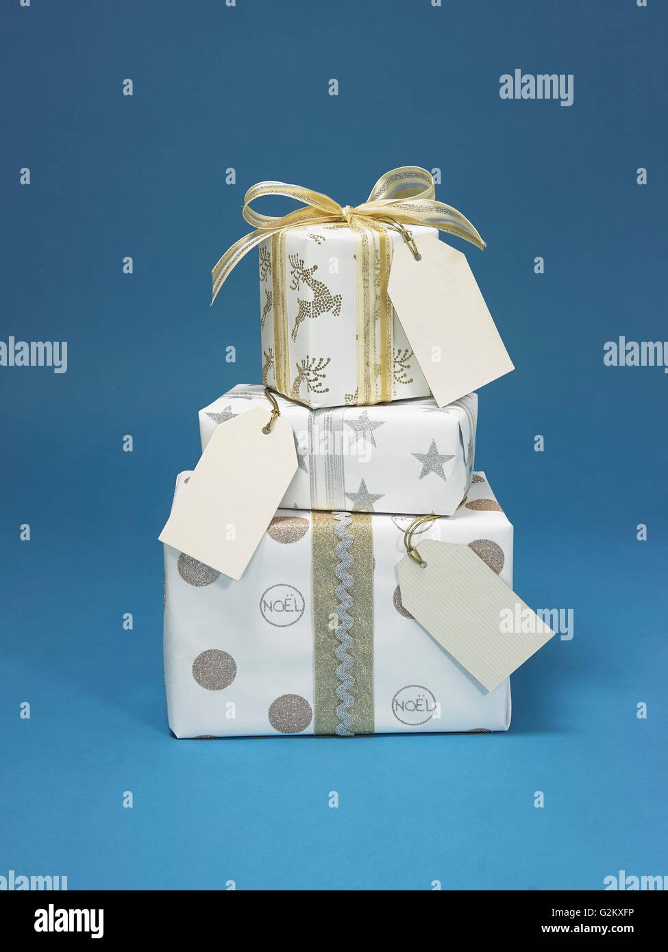 Stack of presents on blue background Stock Photo - Alamy