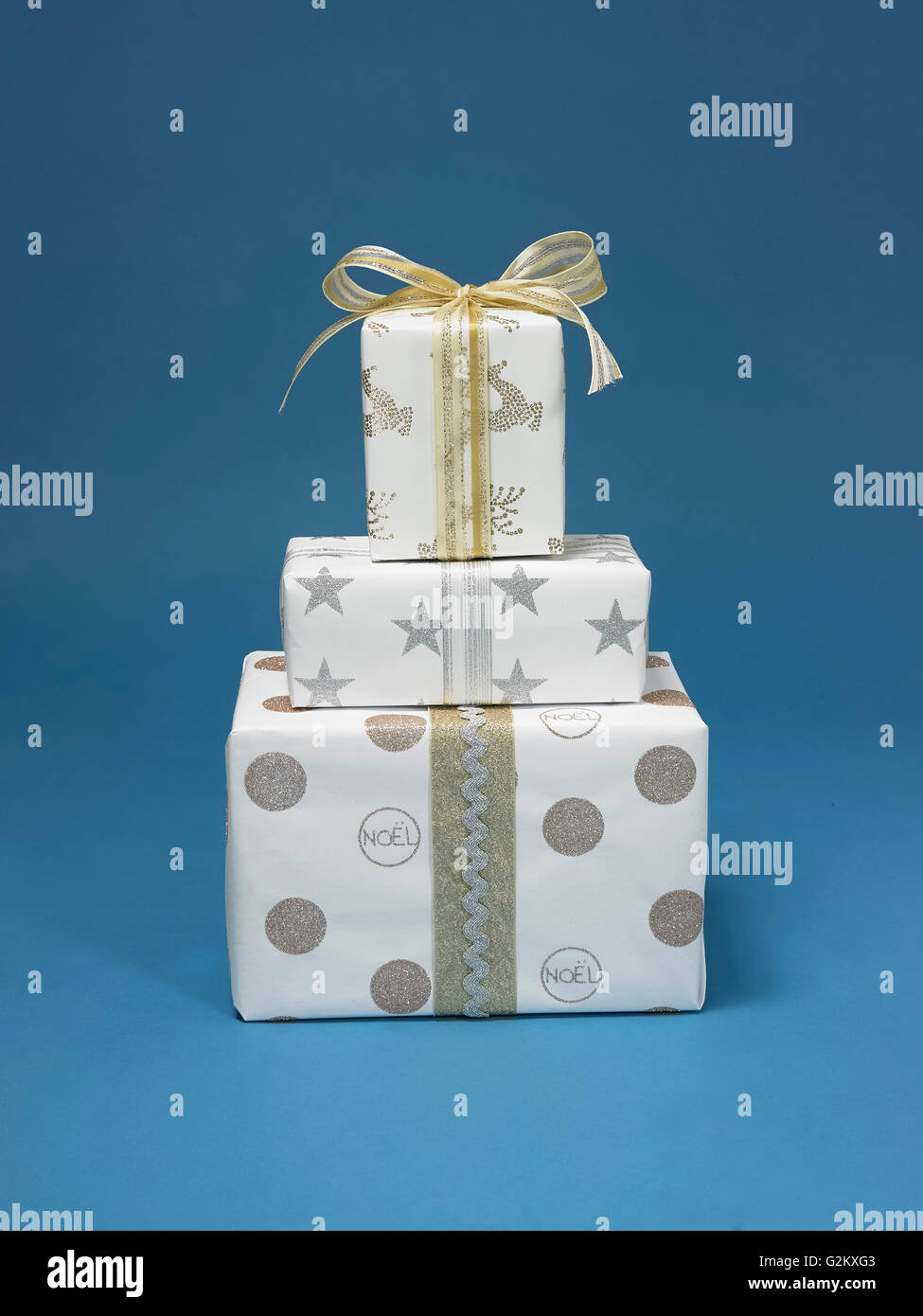 Stack of presents on blue background Stock Photo - Alamy