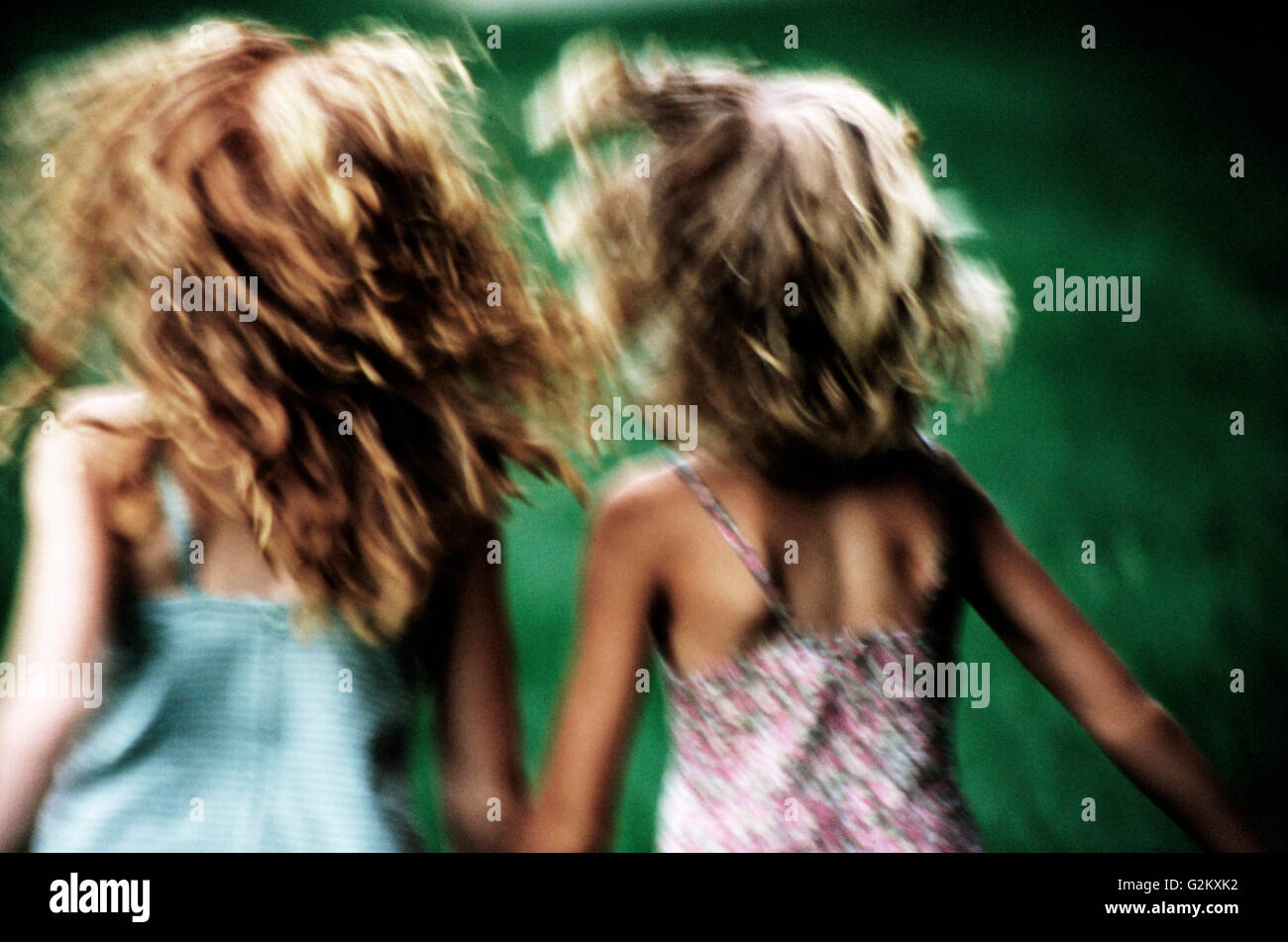Back view of two girls running hi-res stock photography and images - Alamy