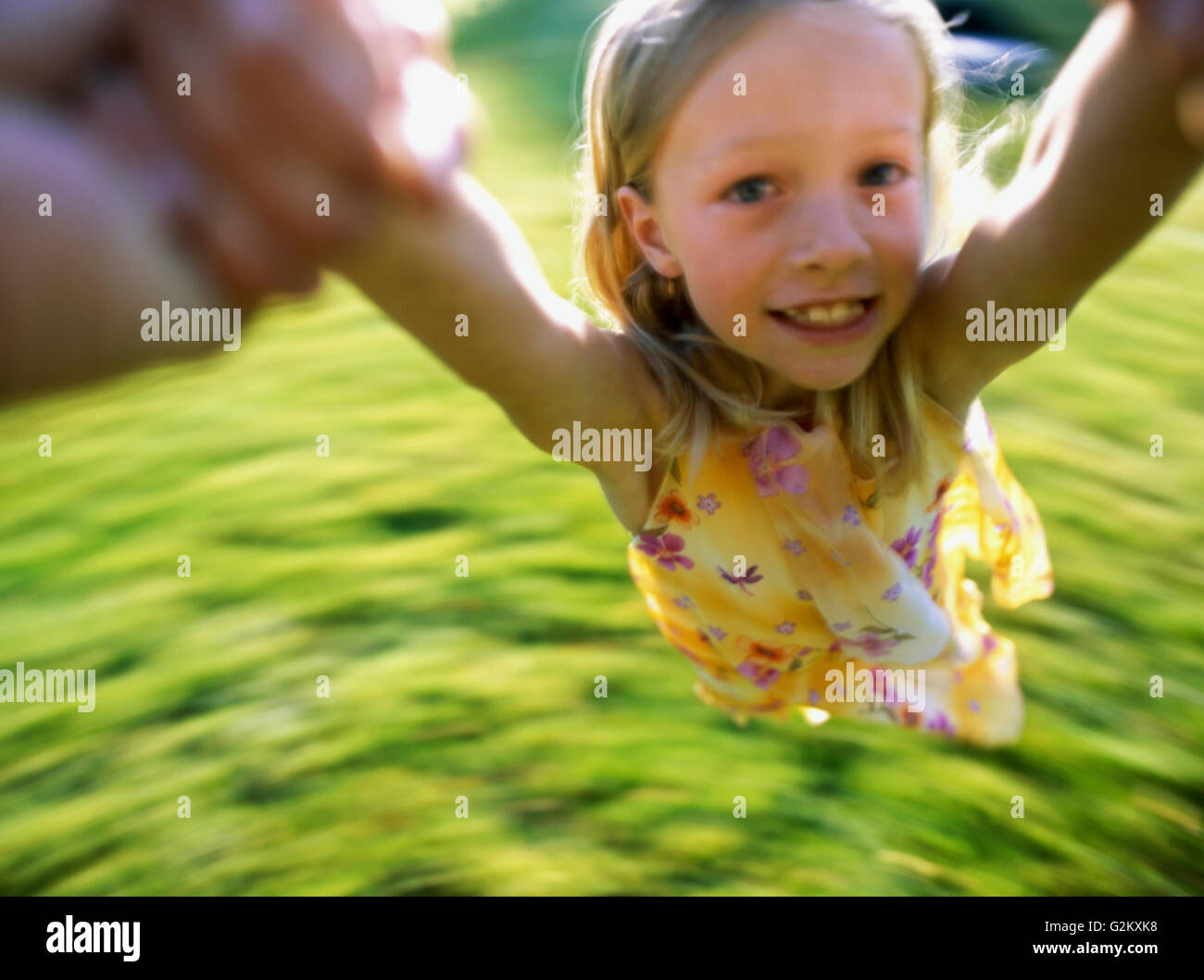 Swinging Girl in Motion Stock Photo - Alamy