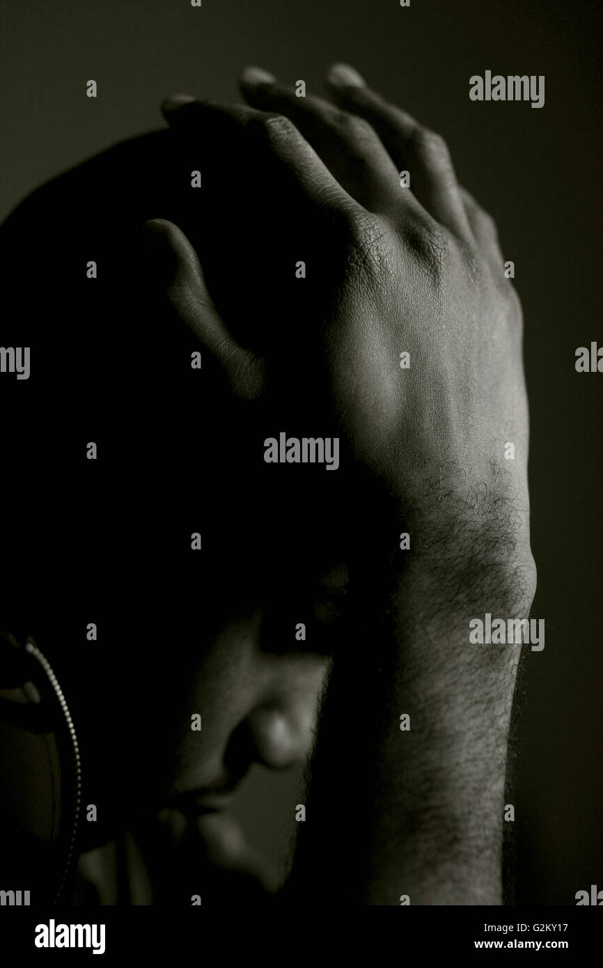 Man with Head in Hand II Stock Photo - Alamy