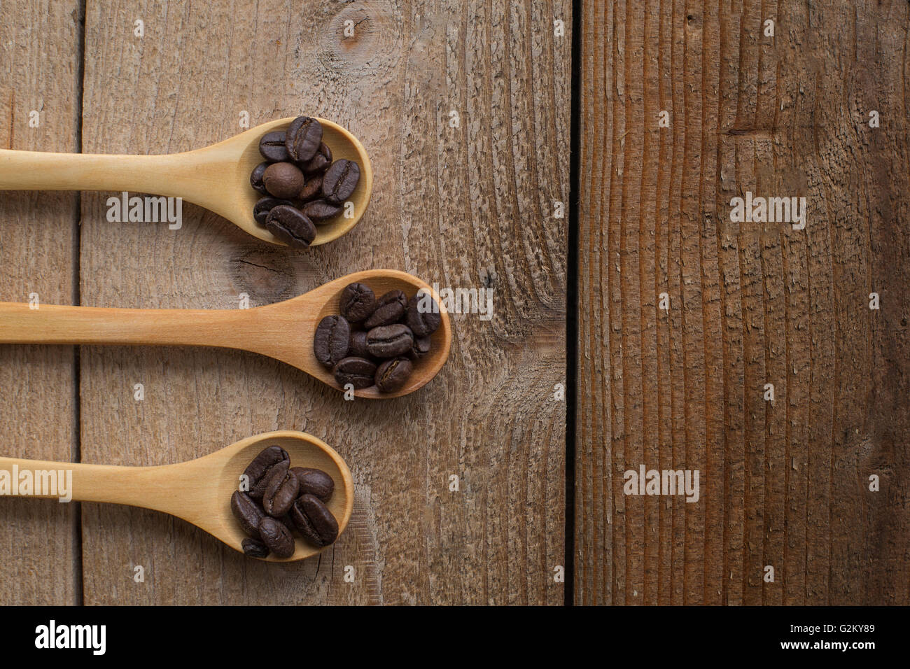 Coffee beans on wood spoon hi-res stock photography and images - Alamy
