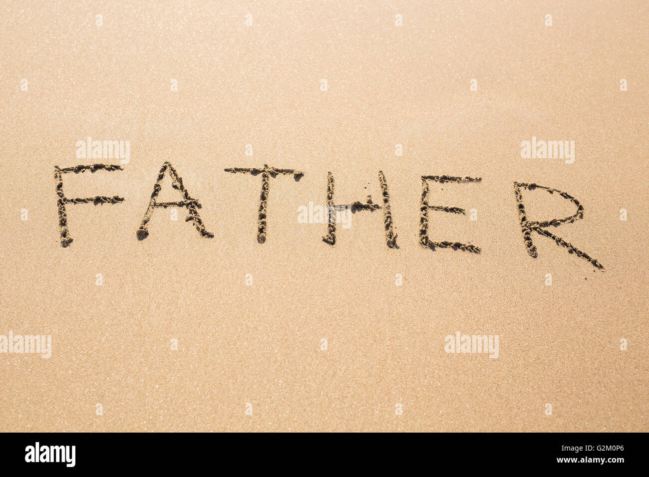 Father hand written in the sandy beach Stock Photo - Alamy