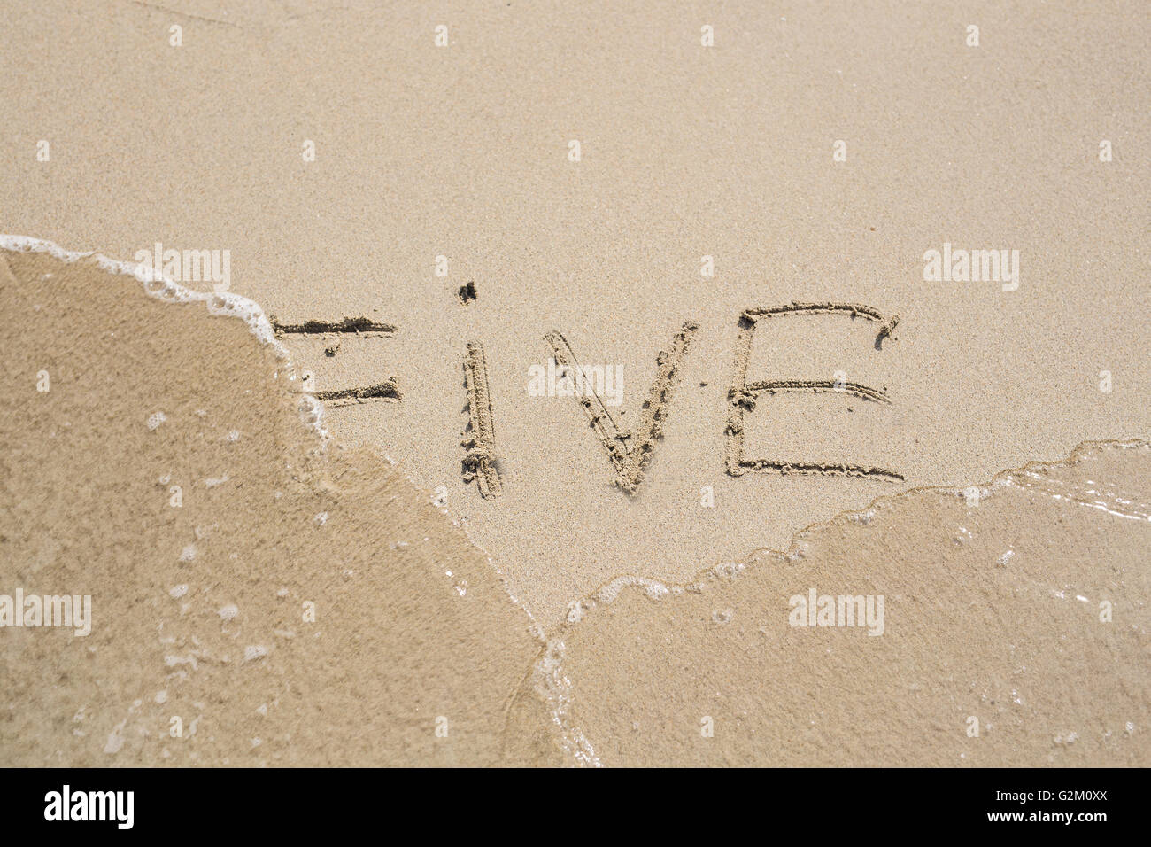 Number five. Sand Alphabet: digits. Concept holiday background Stock ...