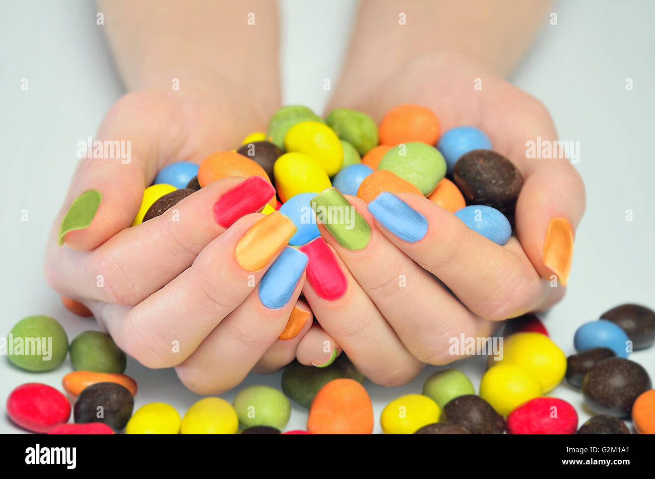 Hand offering candy hi-res stock photography and images - Alamy