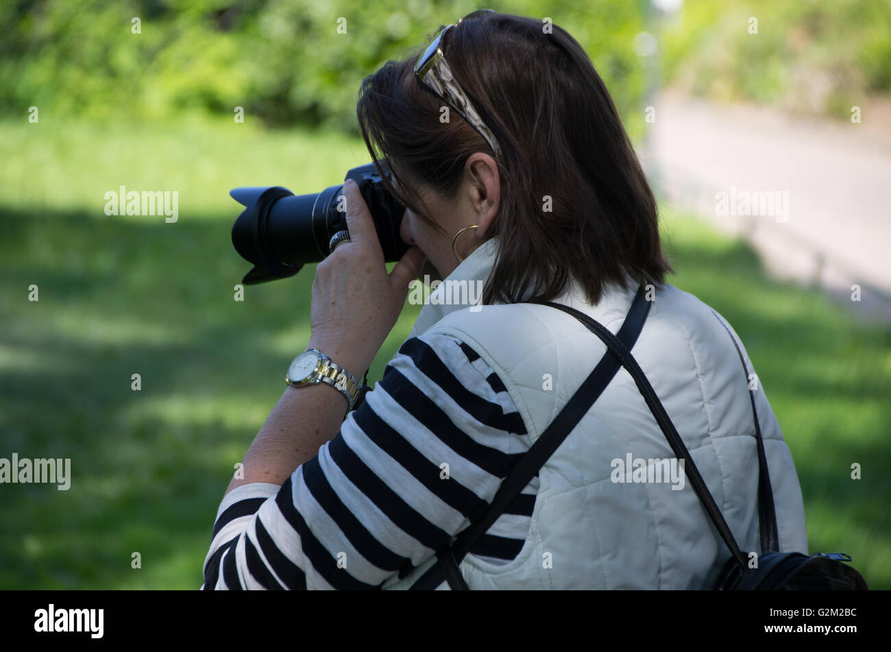 Tourist with camera Stock Photo - Alamy