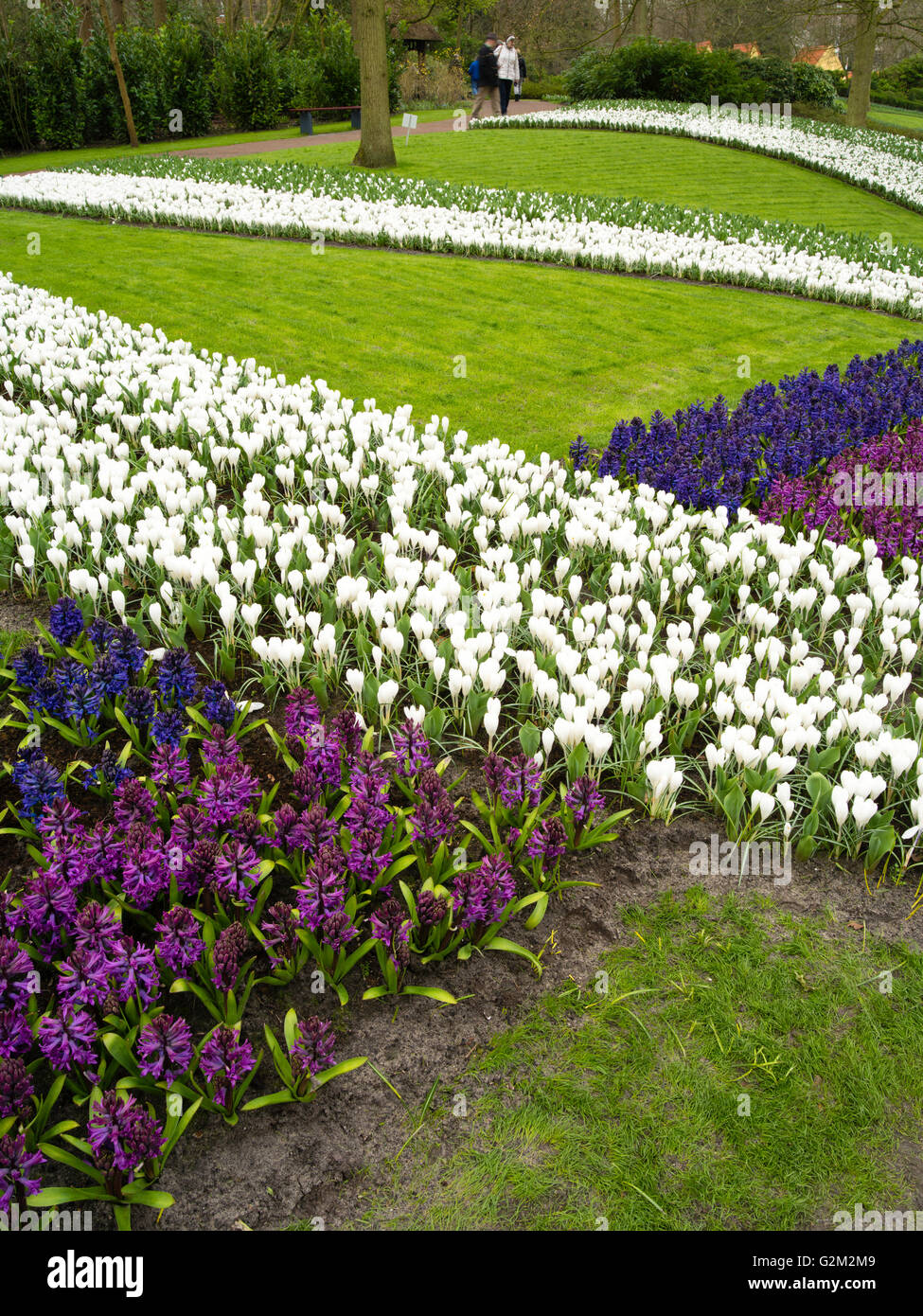 Visitors walk through and enjoy the many different flower displays at ...