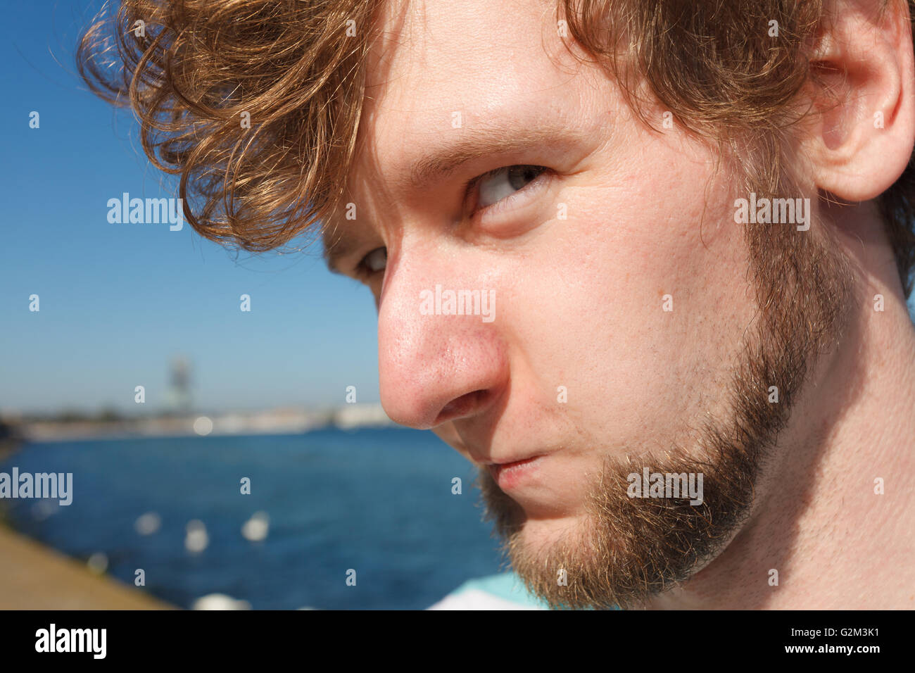 Happy funny young man guy outdoor. Handsome bearded male looking ...