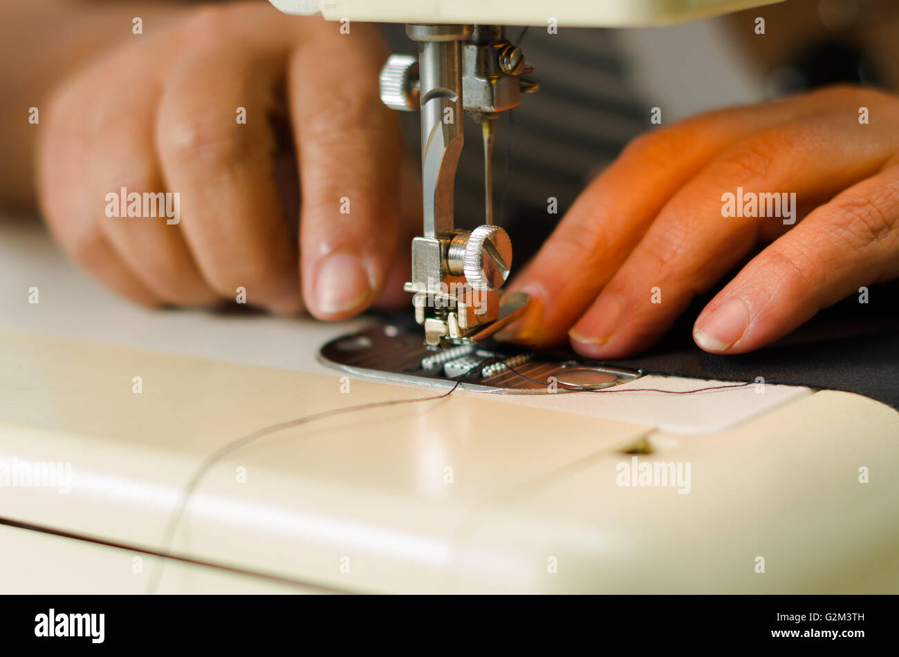 Tailor work in a sewing machine, close up of needle and thread Stock ...