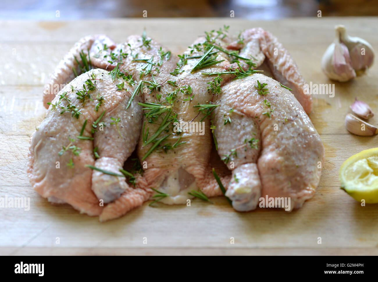 Raw spatchcock (butterfly) chicken and herbs Stock Photo - Alamy