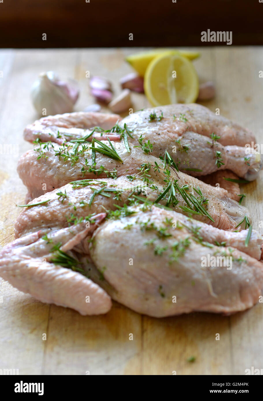 Raw spatchcock (butterfly) chicken and herbs Stock Photo - Alamy
