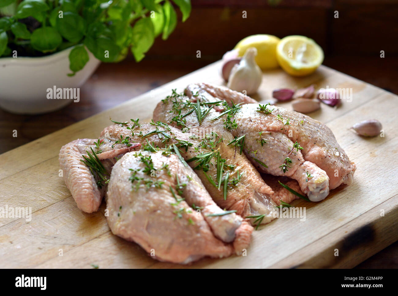 Raw spatchcock (butterfly) chicken and herbs Stock Photo - Alamy