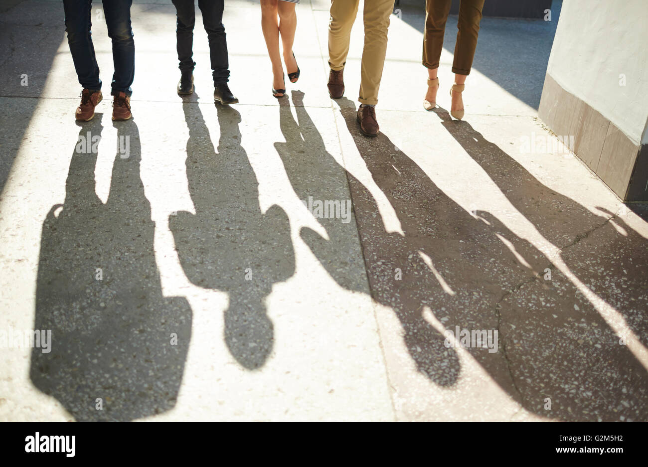 Walking business team Stock Photo - Alamy