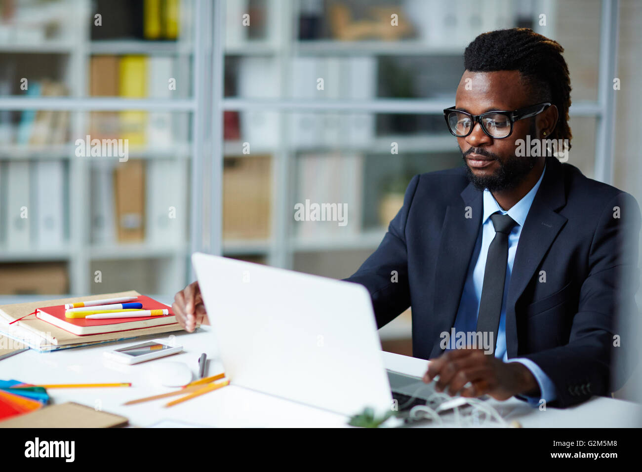 African man technology typing hi-res stock photography and images - Alamy