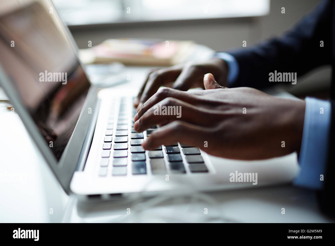 Fingers over keypad Stock Photo - Alamy