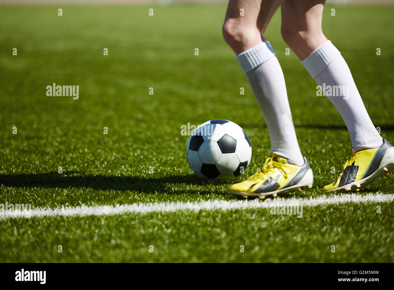 Legs of football player Stock Photo - Alamy