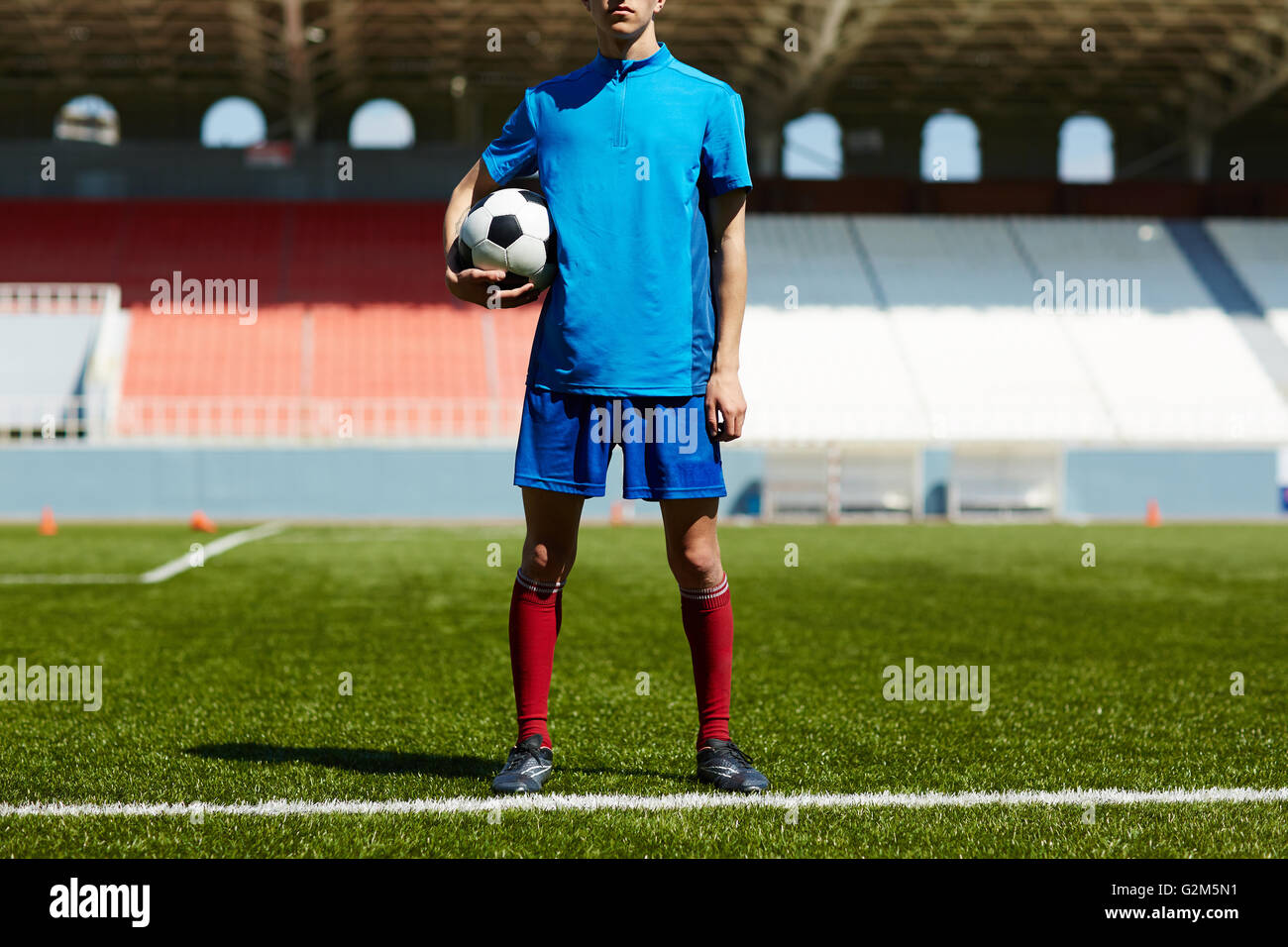 Footballer on the field Stock Photo - Alamy