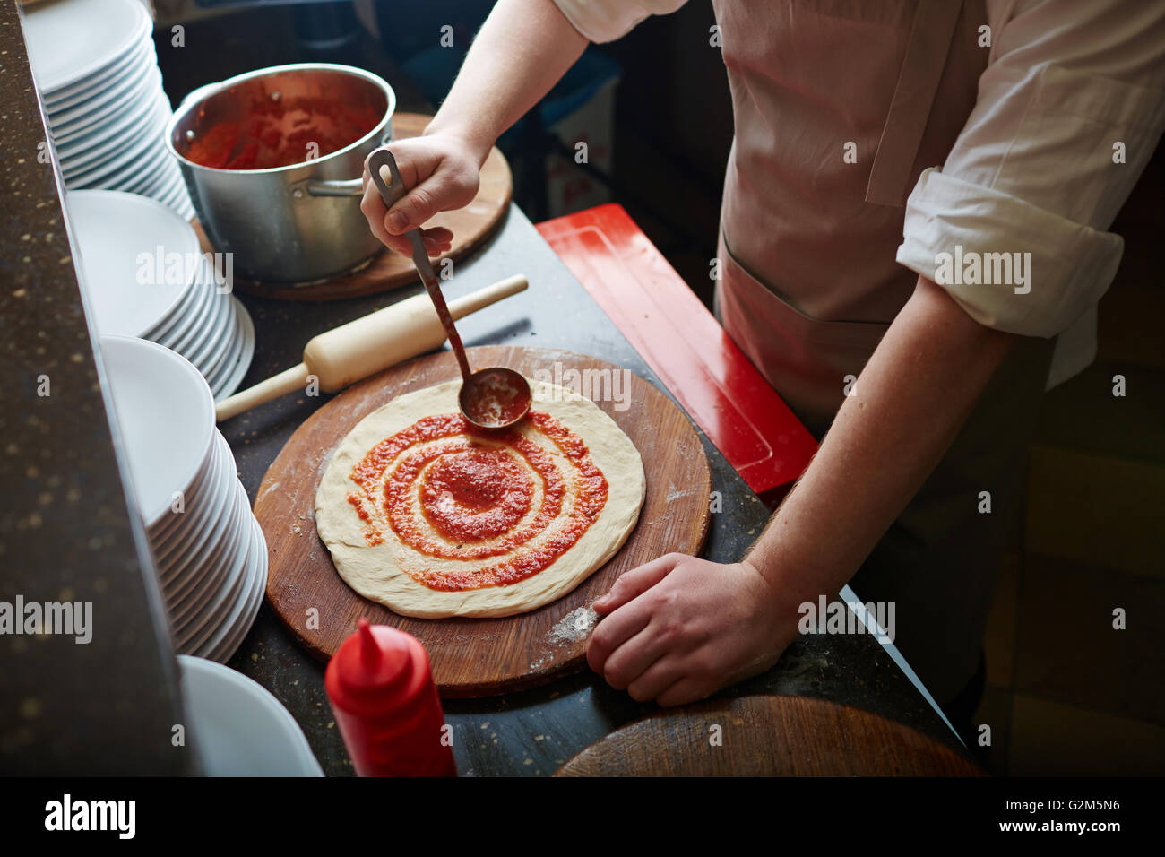 Preparation of pizza Stock Photo - Alamy