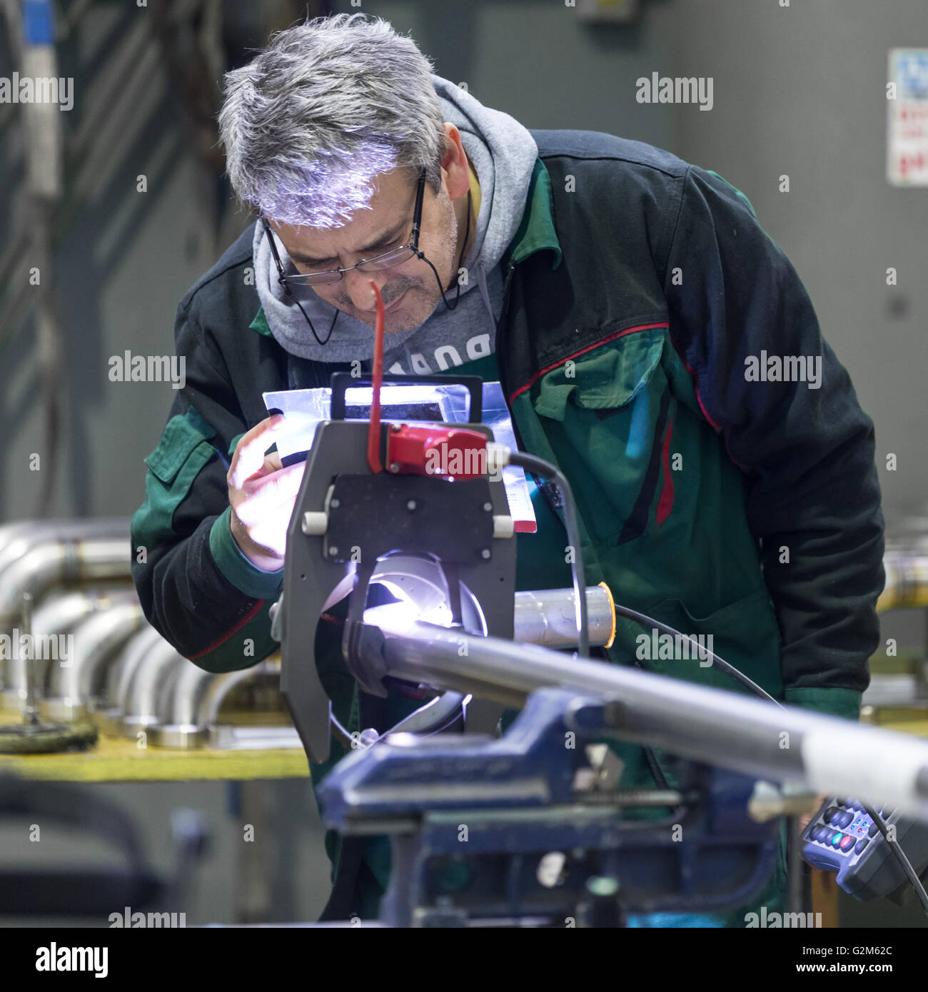 Industrial worker setting orbital welding machine Stock Photo - Alamy