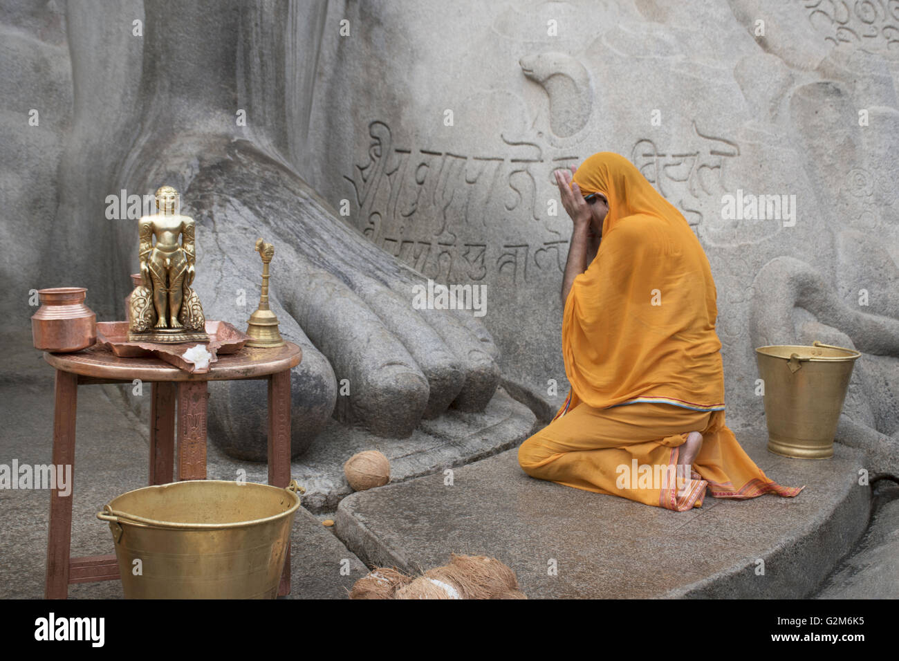 Jain priests performing religious rituals to Bahubali, also known as ...