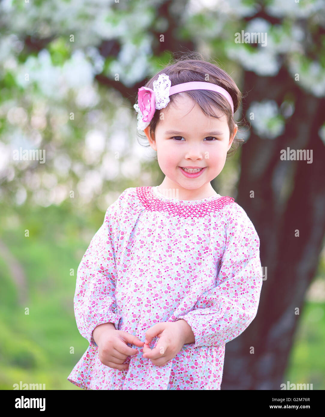 Sweet little girl outdoors Stock Photo - Alamy