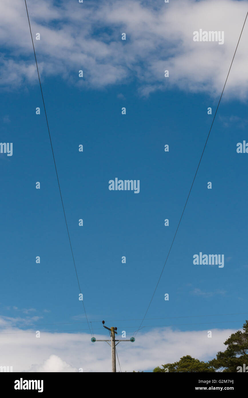 telephone wire with blue sky behind Stock Photo - Alamy