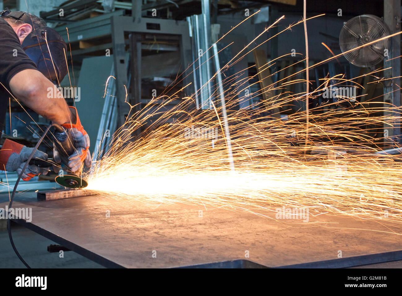 sparks during metal grinding in a steel factory Stock Photo - Alamy