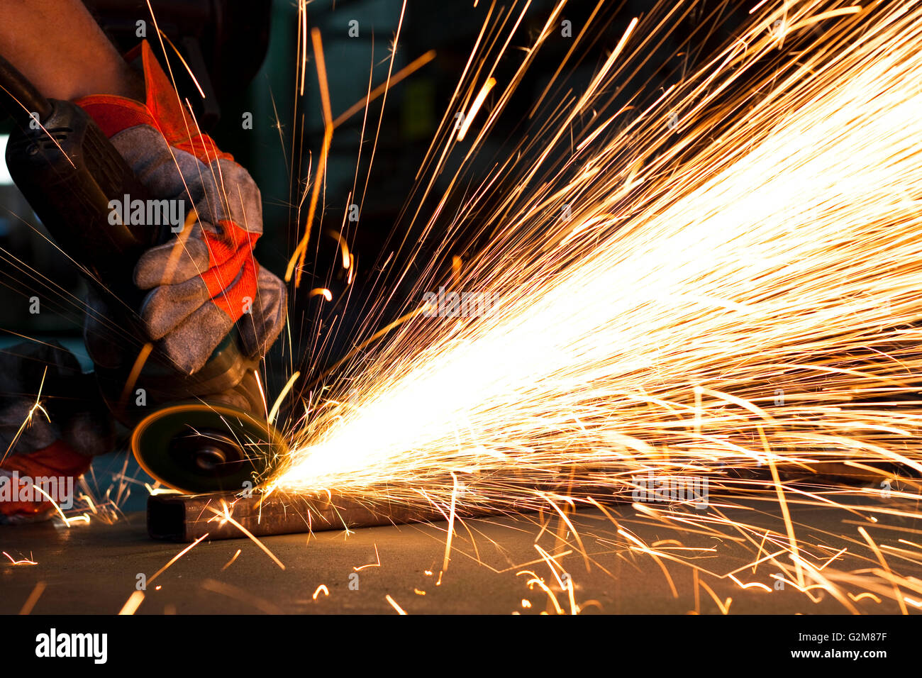 sparks while grinding in a steel factory Stock Photo - Alamy