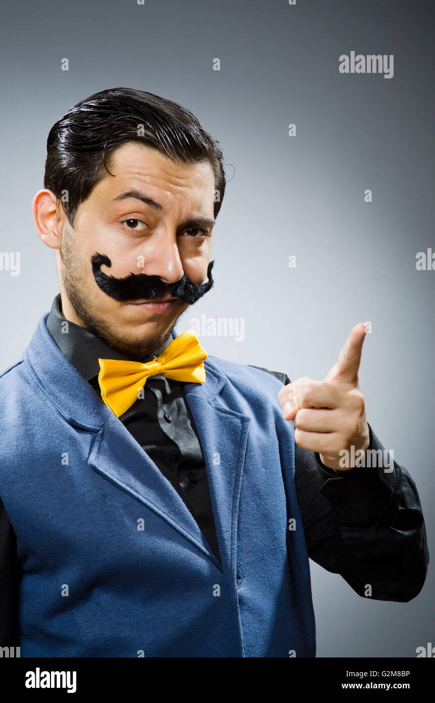 Funny man against dark background Stock Photo - Alamy