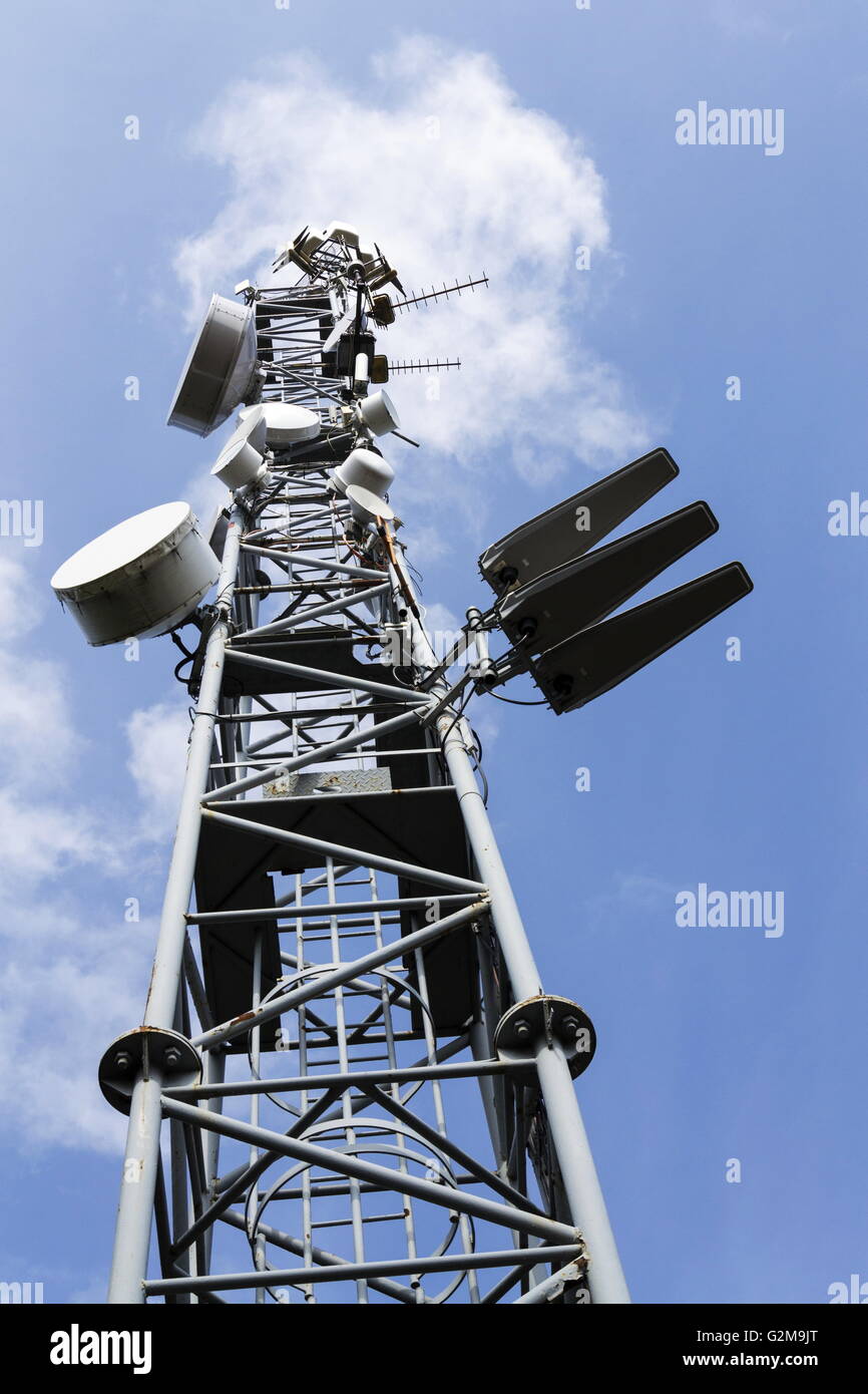 Cell phone transmitters on telecommunication tower on a sunny day Stock ...