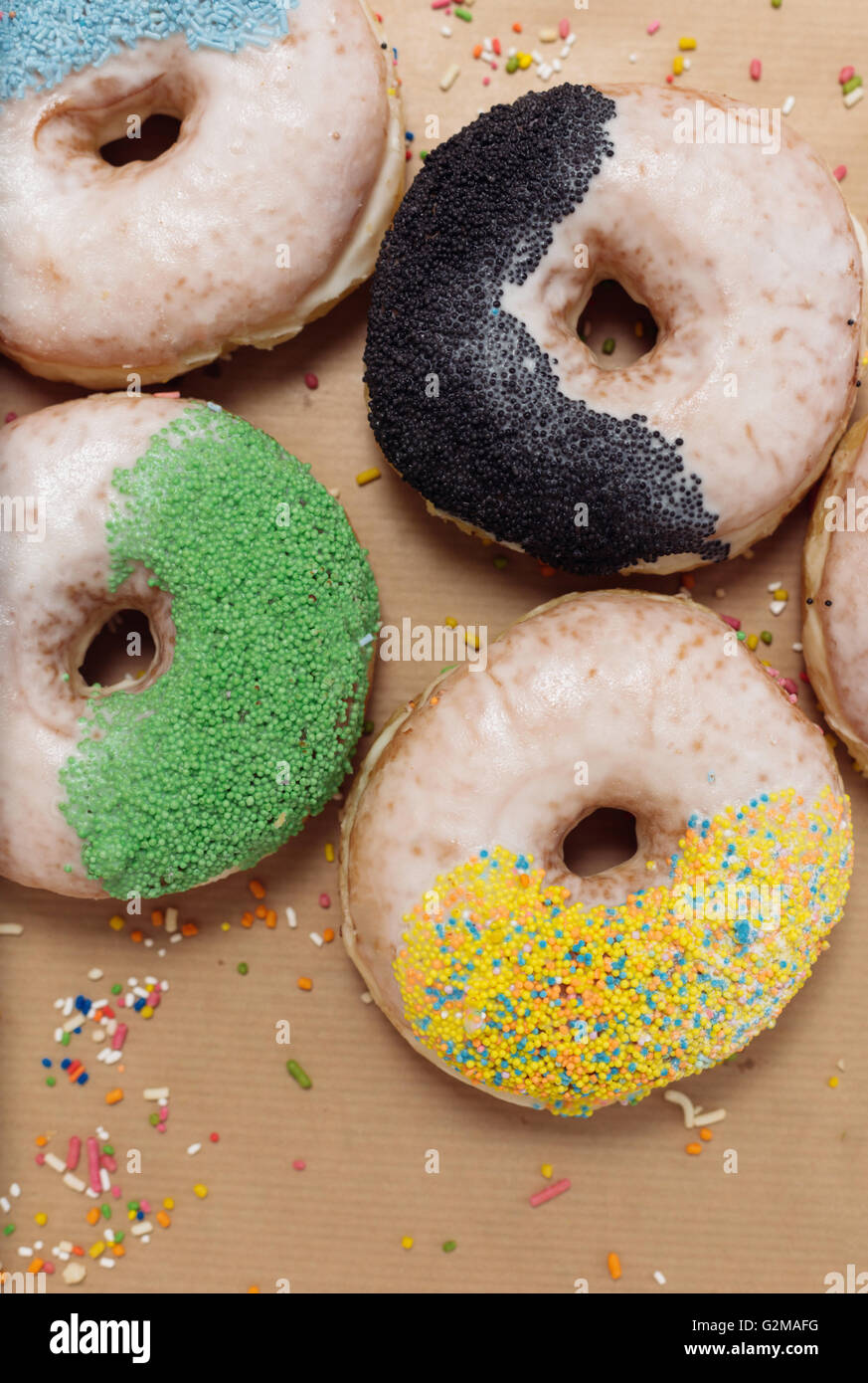 Colorful donuts on paper background Stock Photo - Alamy