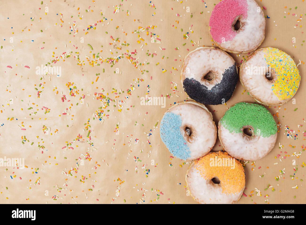 Colorful donuts on paper background Stock Photo - Alamy