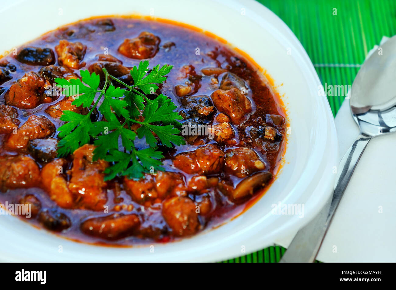Plate with stew of pork meat Stock Photo - Alamy