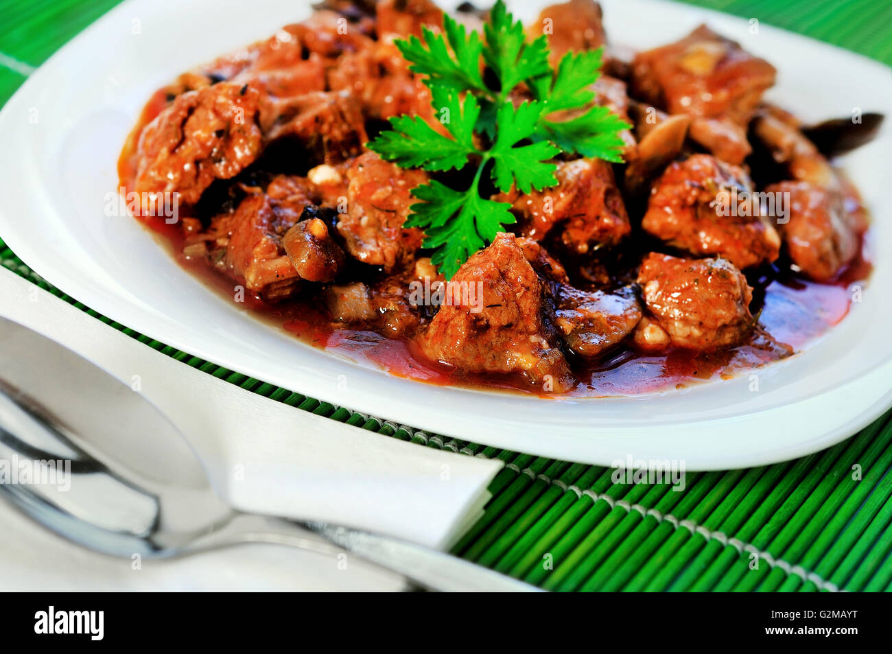 Plate with stew of pork meat Stock Photo - Alamy