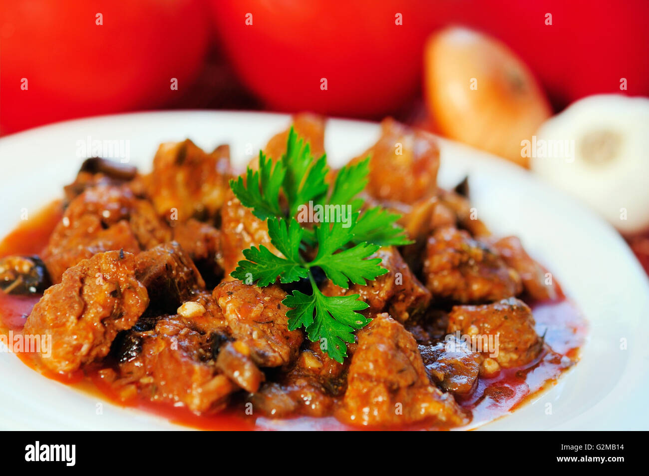 Plate with stew of pork meat Stock Photo - Alamy