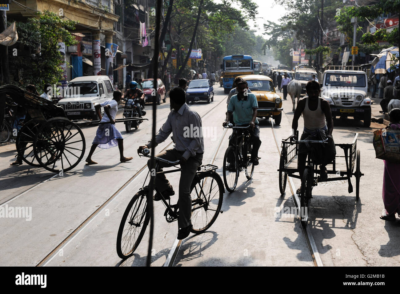 INDIA Westbengal, Kolkata, traffic with bicycle and man-powered ...
