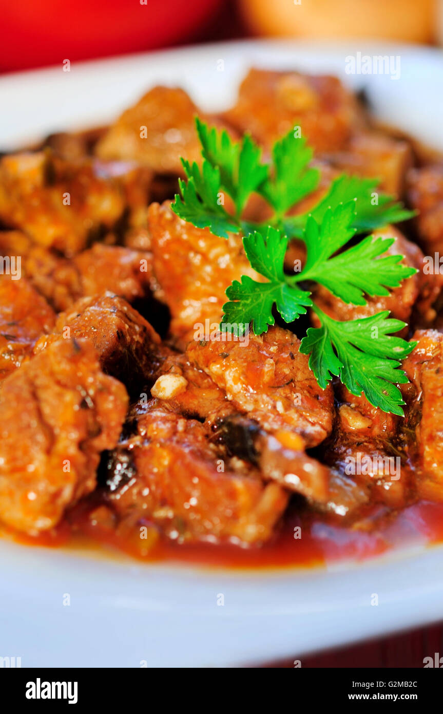 Plate with stew of pork meat Stock Photo - Alamy