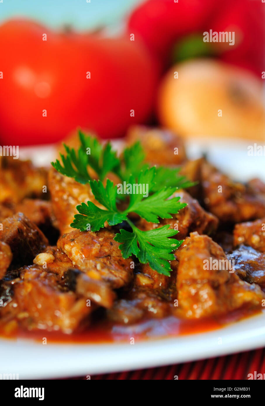 Plate with stew of pork meat Stock Photo - Alamy