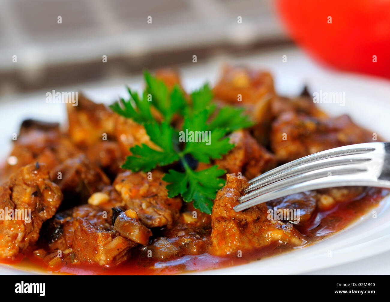 Plate with stew of pork meat Stock Photo - Alamy
